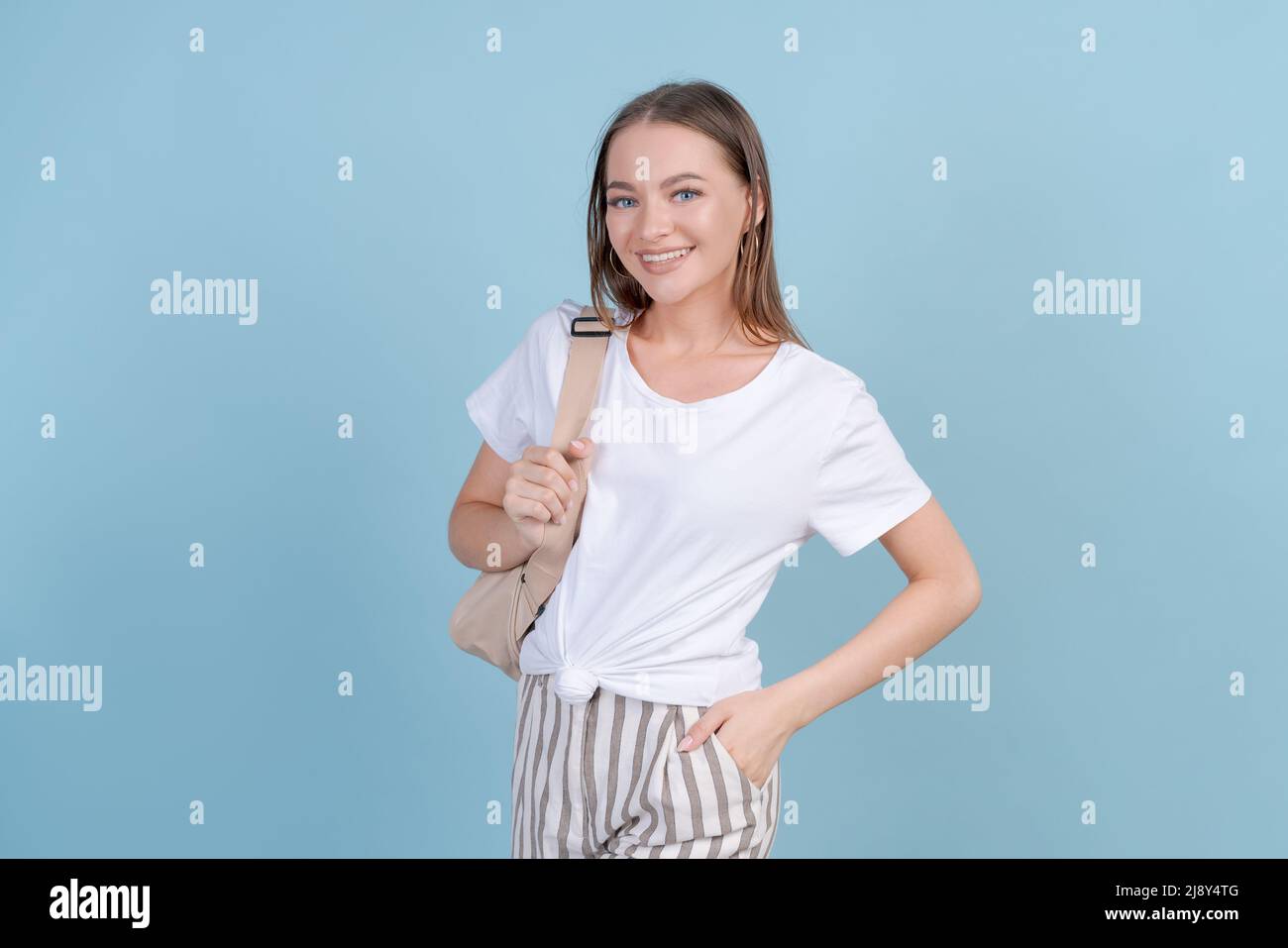 Positive college student girl holding backpack on her back ...