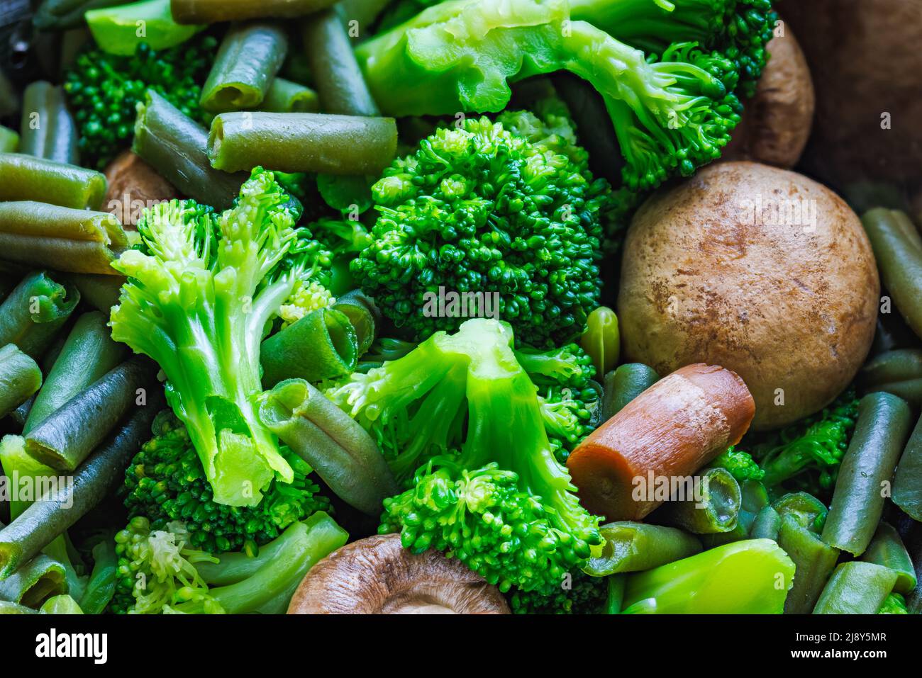 boiled green vegetables in stainless steel colander - full-frame ...