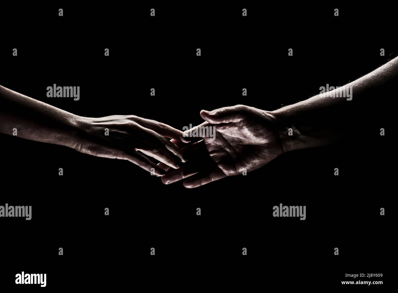 Two hands reaching toward. Helping hand outstretched for salvation on ...