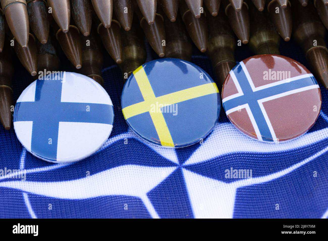 Finnish, Swedish and Norwegian Buttons on a NATO Flag with ammunition ...
