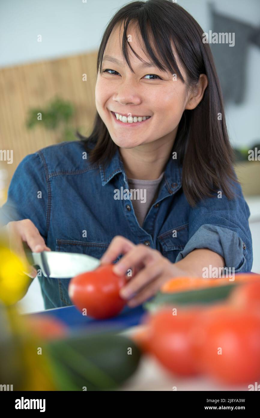 Young happy woman cutting hi-res stock photography and images - Alamy