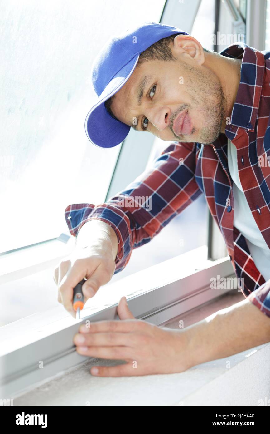 happy handsome windows installation worker Stock Photo - Alamy