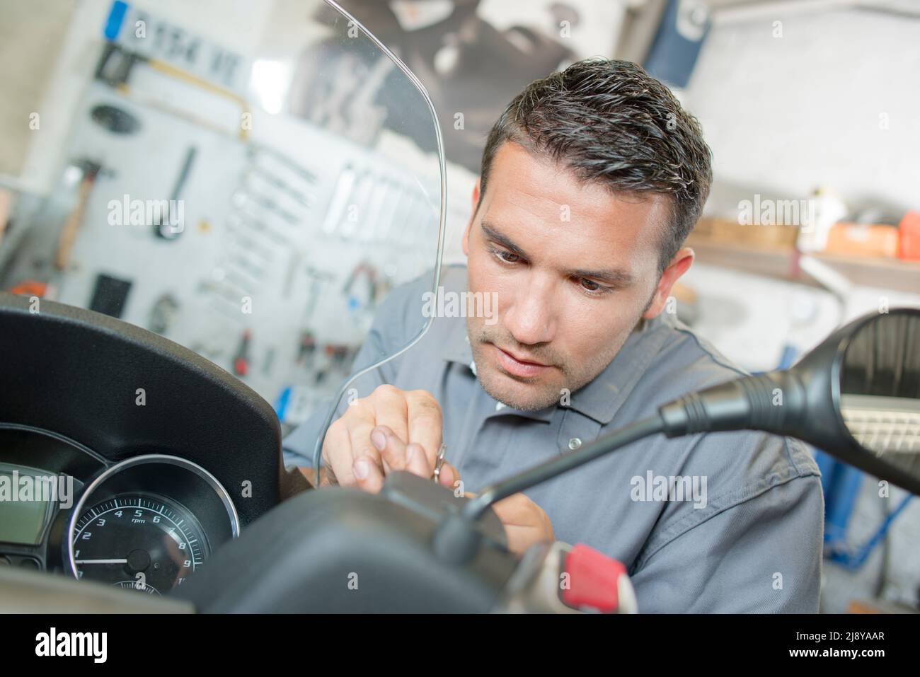 Repairing a scooter hi-res stock photography and images - Alamy