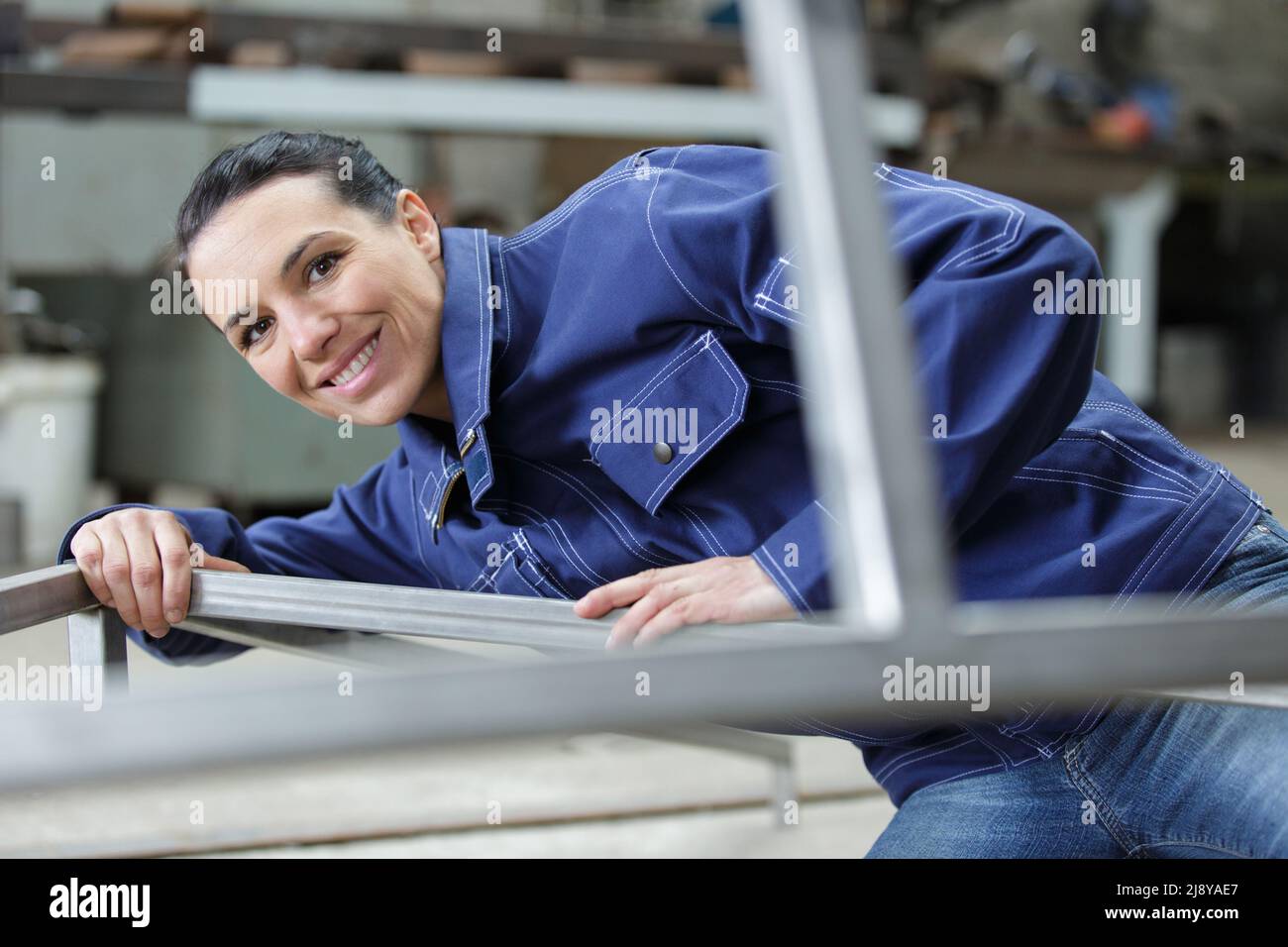 metal worker woman concentrated on her job Stock Photo - Alamy