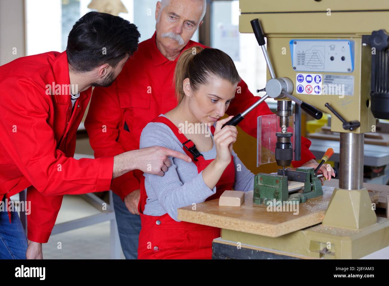 Female mechanic operating drilling machine hi-res stock photography and ...