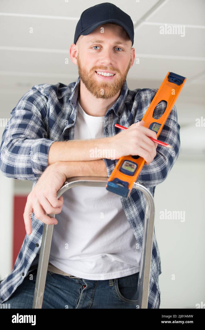 Construction man ladder level hi-res stock photography and images - Alamy