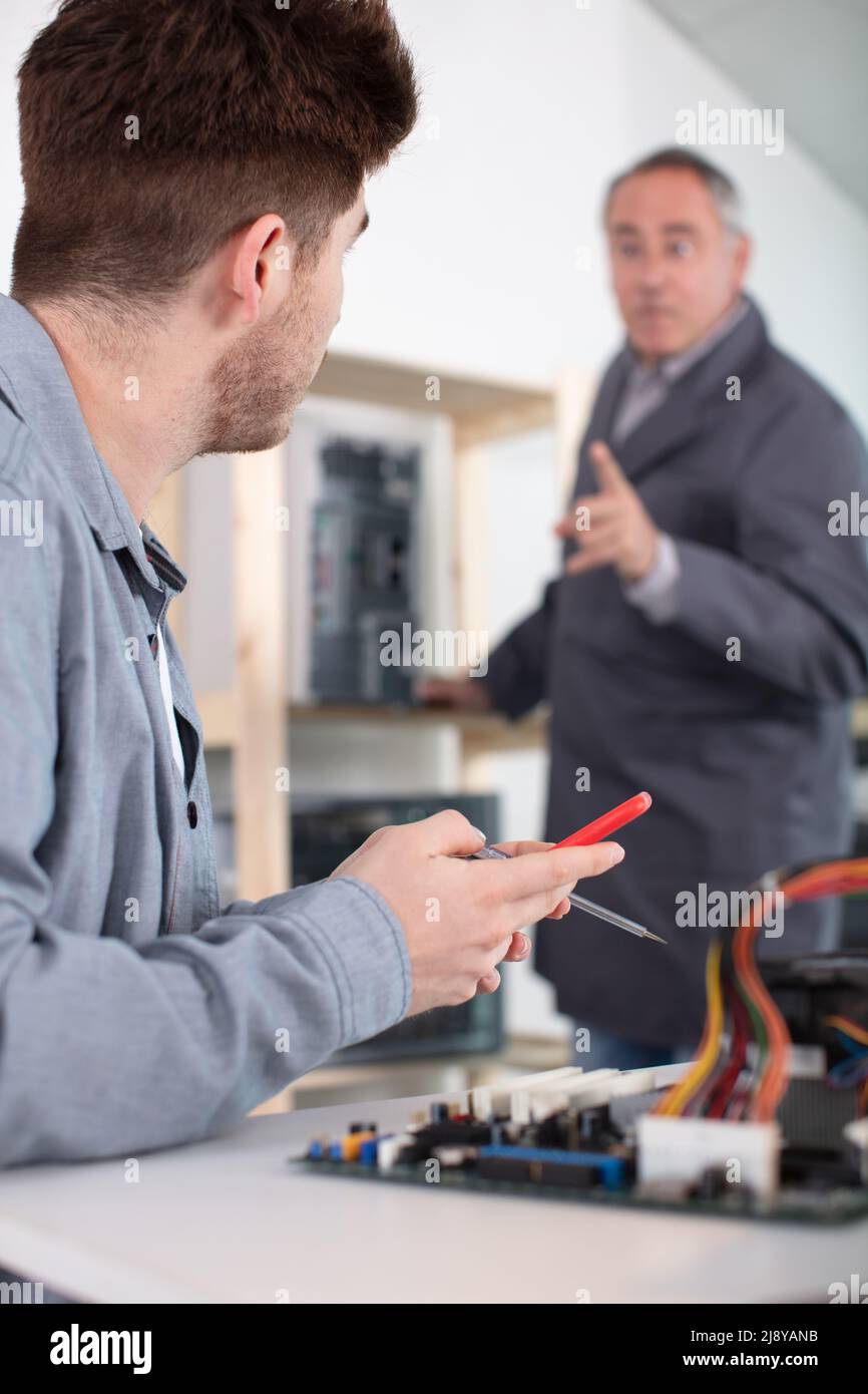 future electronic assembler student with teacher Stock Photo - Alamy