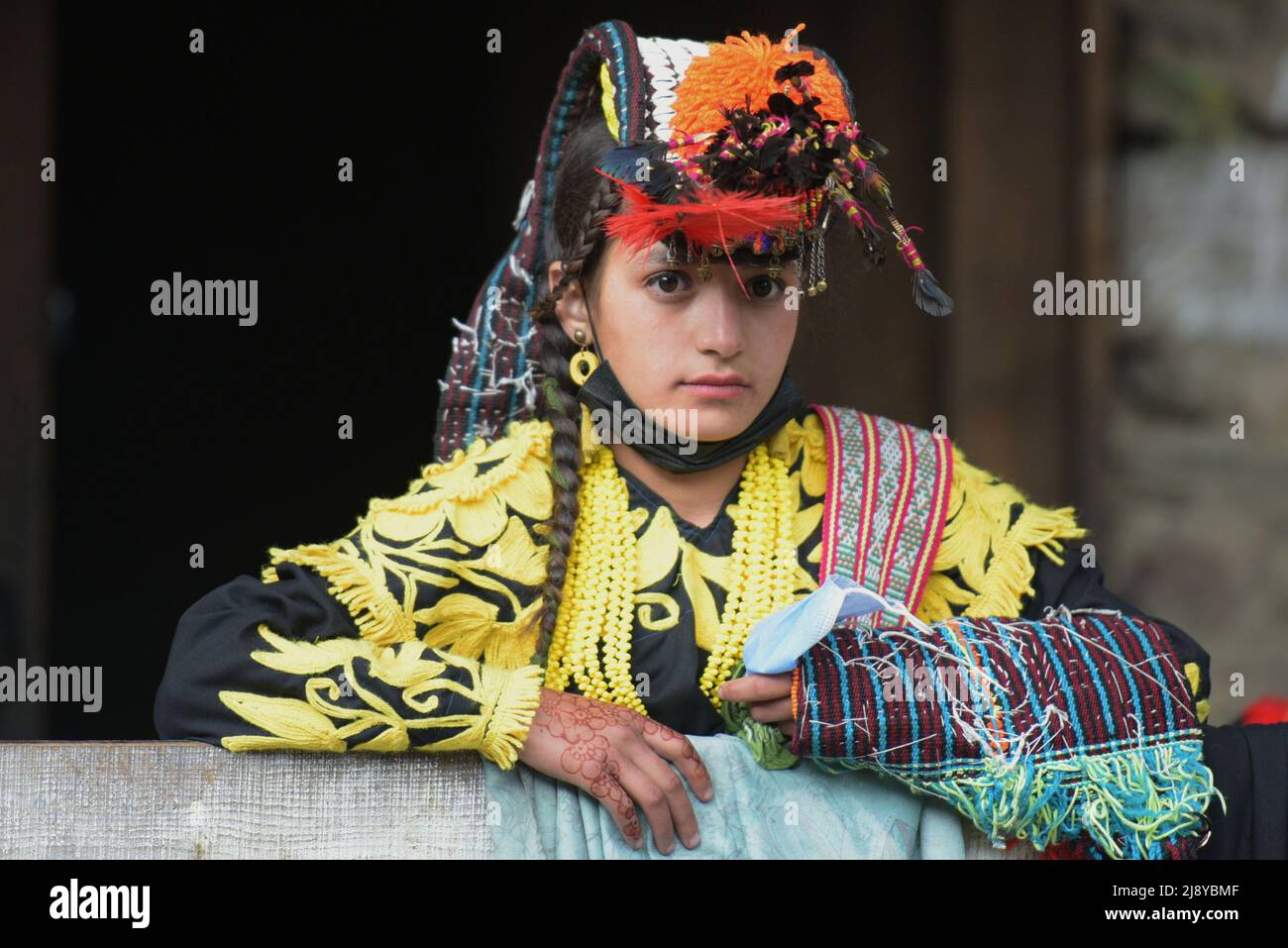 Kalashi women and men wearing traditional dresses participating in the ...