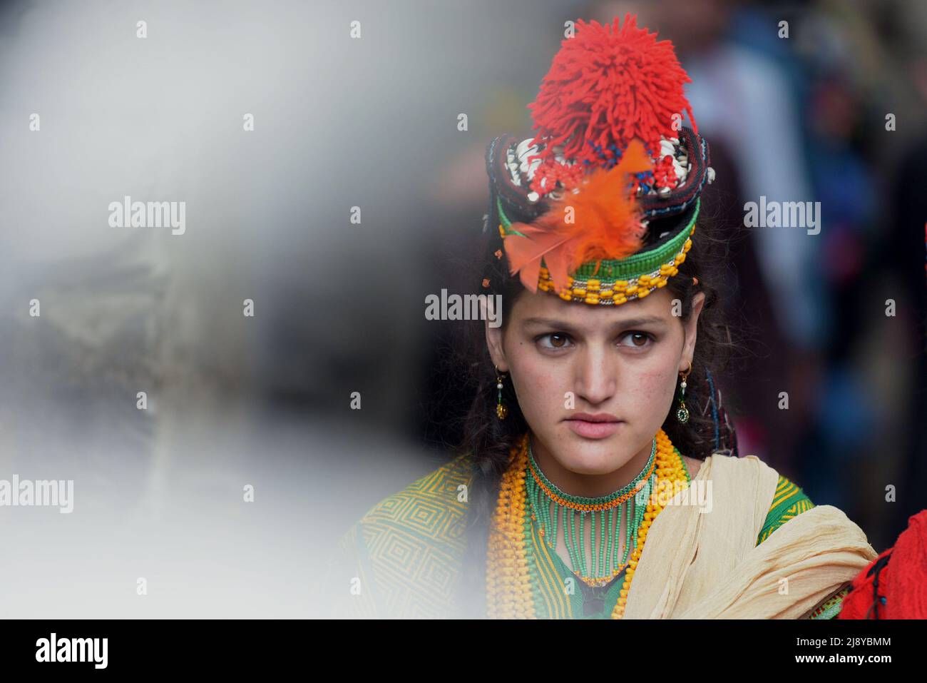 Kalashi women and men wearing traditional dresses participating in the ...