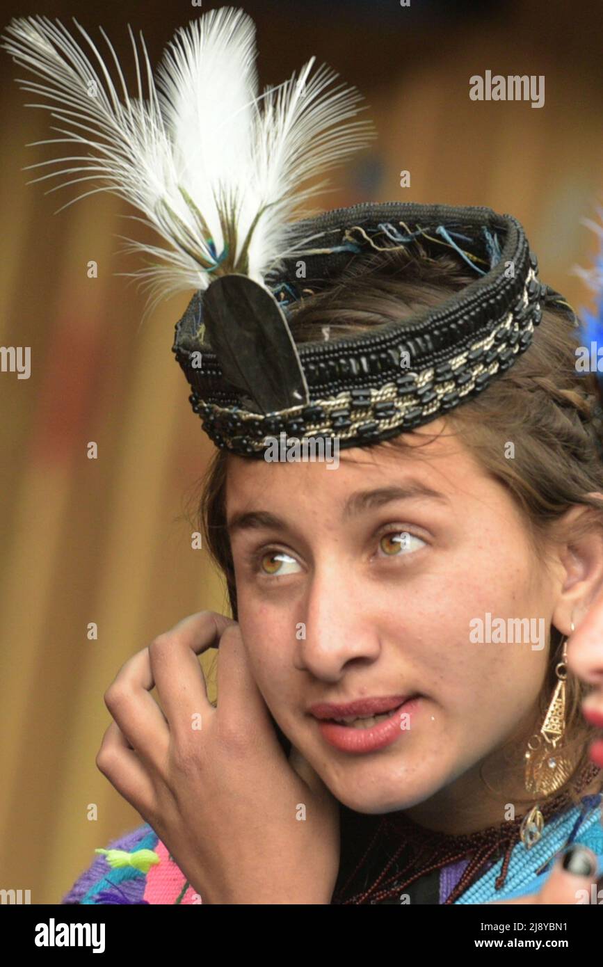 Kalashi women and men wearing traditional dresses participating in the ...