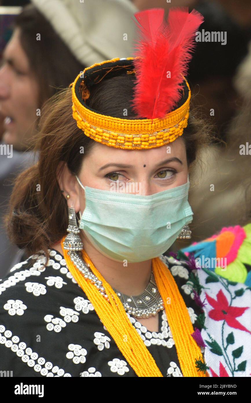 Kalashi women and men wearing traditional dresses participating in the ...