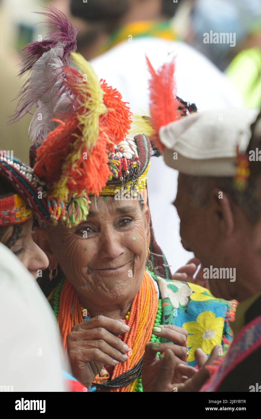Kalashi women and men wearing traditional dresses participating in the ...
