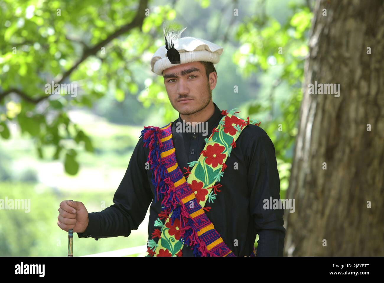 Kalashi women and men wearing traditional dresses participating in the ...