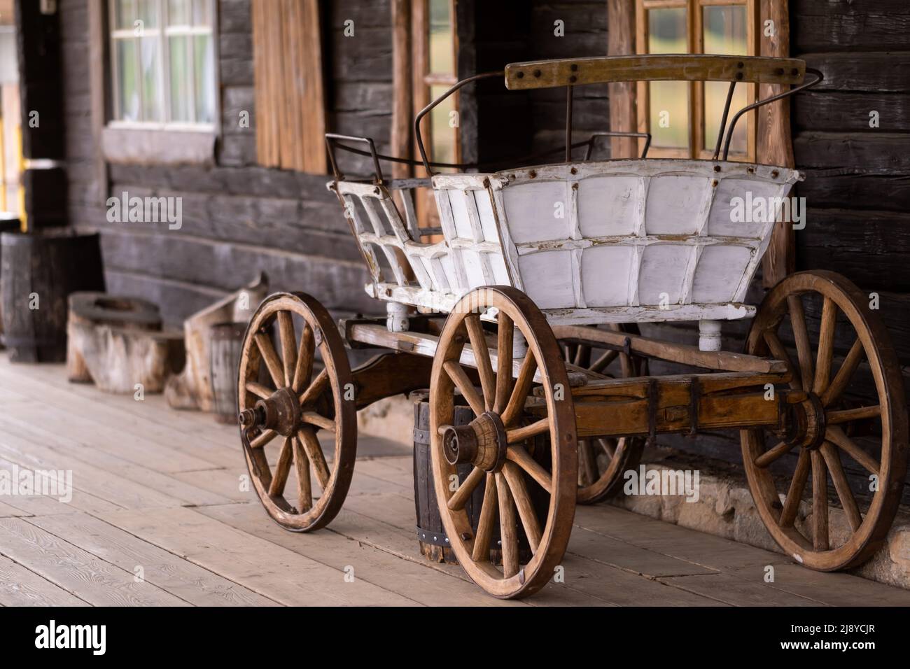 An empty antique carriage stands on a ranch in the wild West Stock ...