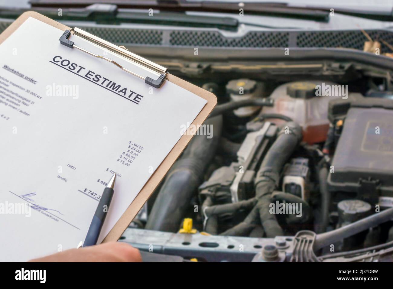 Estimate in a garage for the annual inspection of the car Stock Photo ...