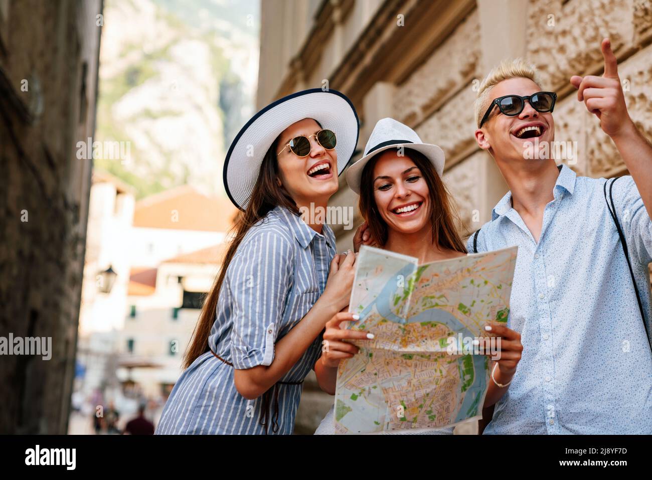 Group of happy friends enjoying travel and summer vacation together ...