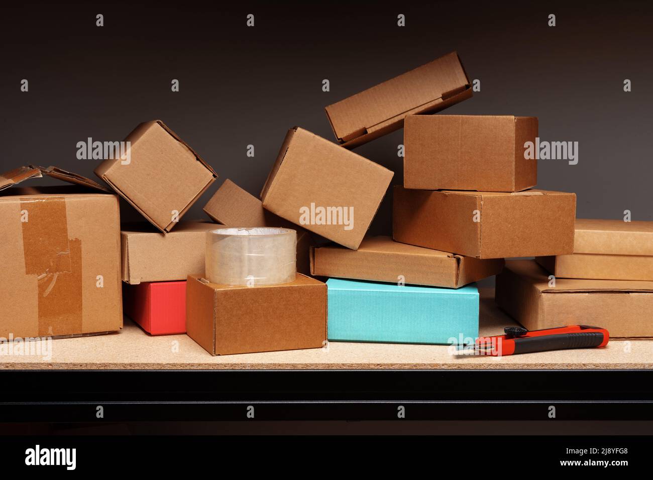 Warehouse shelves with small paper boxes, close up Stock Photo - Alamy