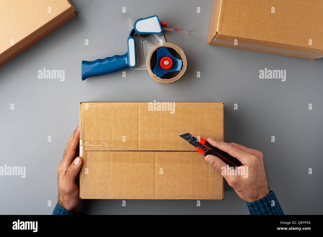 Above table top view of warehouse preparing post courier delivery ...