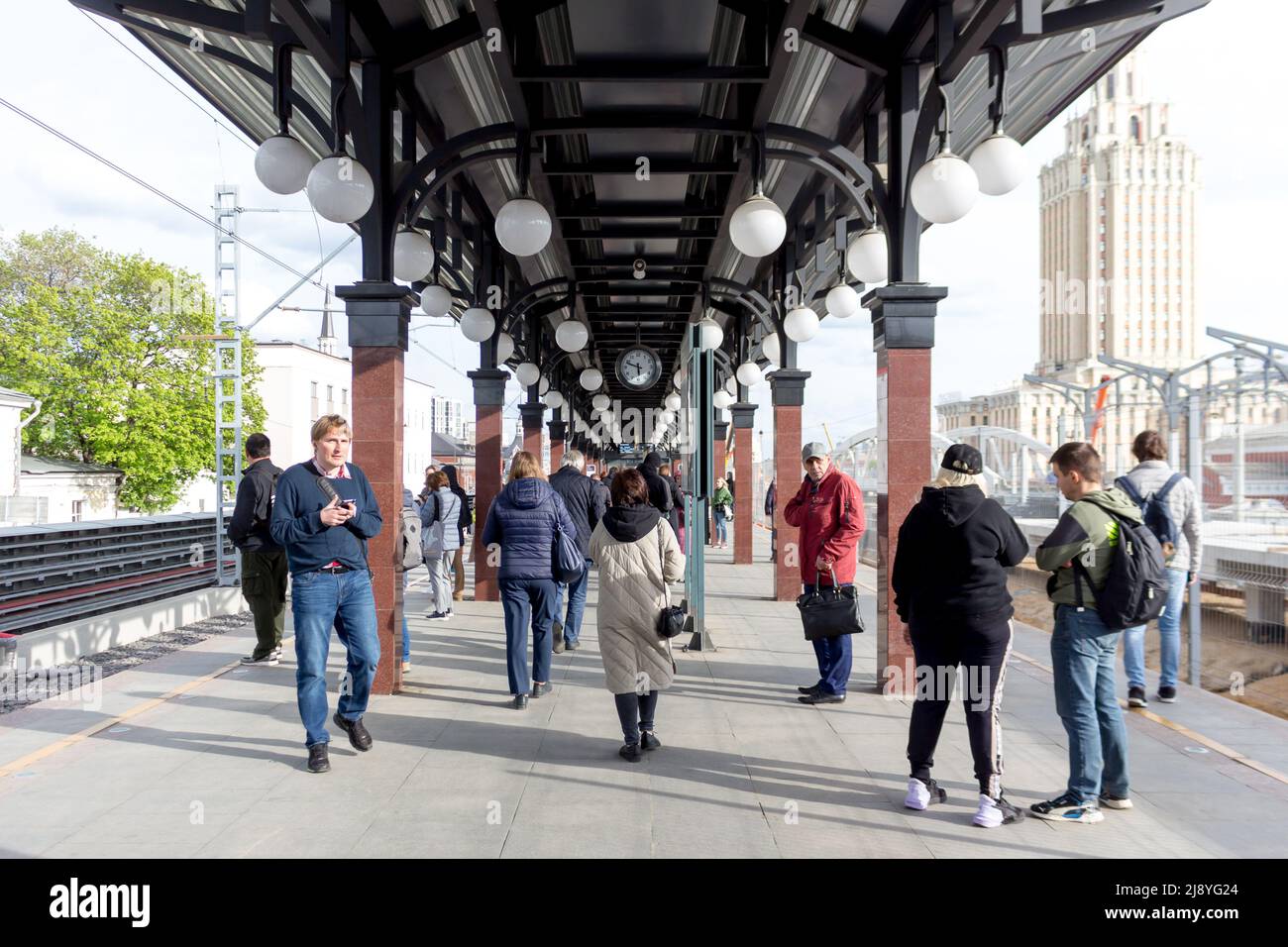 Group of friends waiting the train in the platform of subway station ...