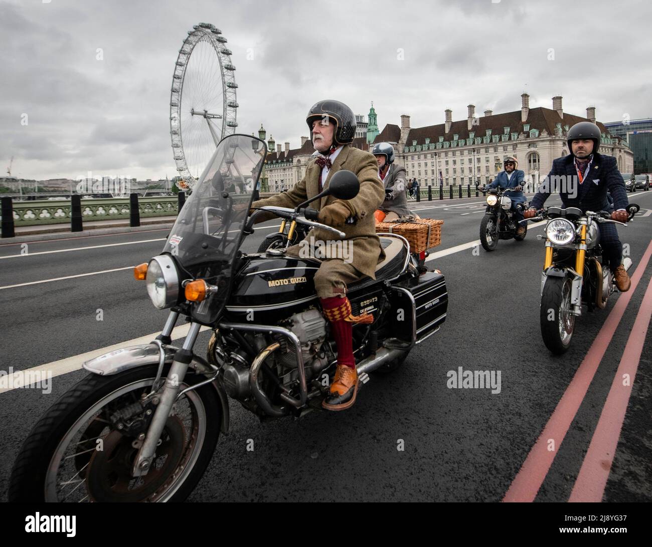 EDITORIAL USE ONLY Riders in London with their vintage bikes ahead of ...