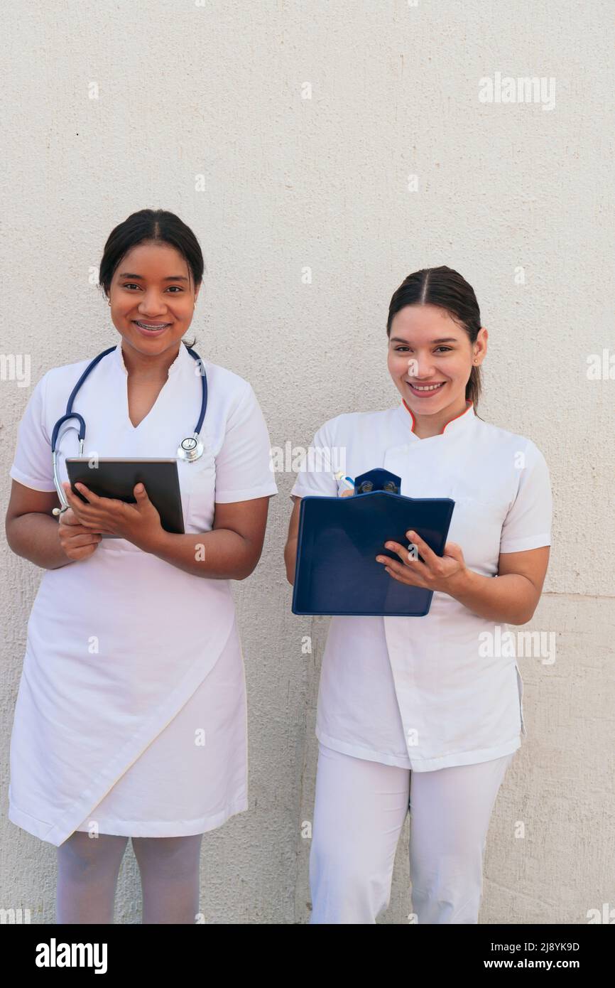 Portrait of smiling nurses at work in a hospital Stock Photo - Alamy