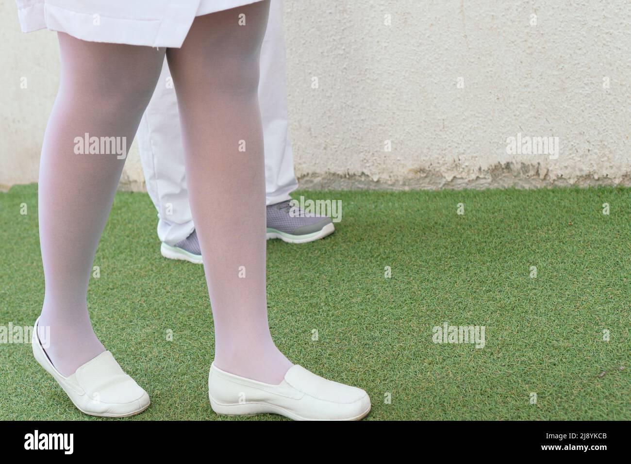 Two nurses walking around the hospital Stock Photo - Alamy