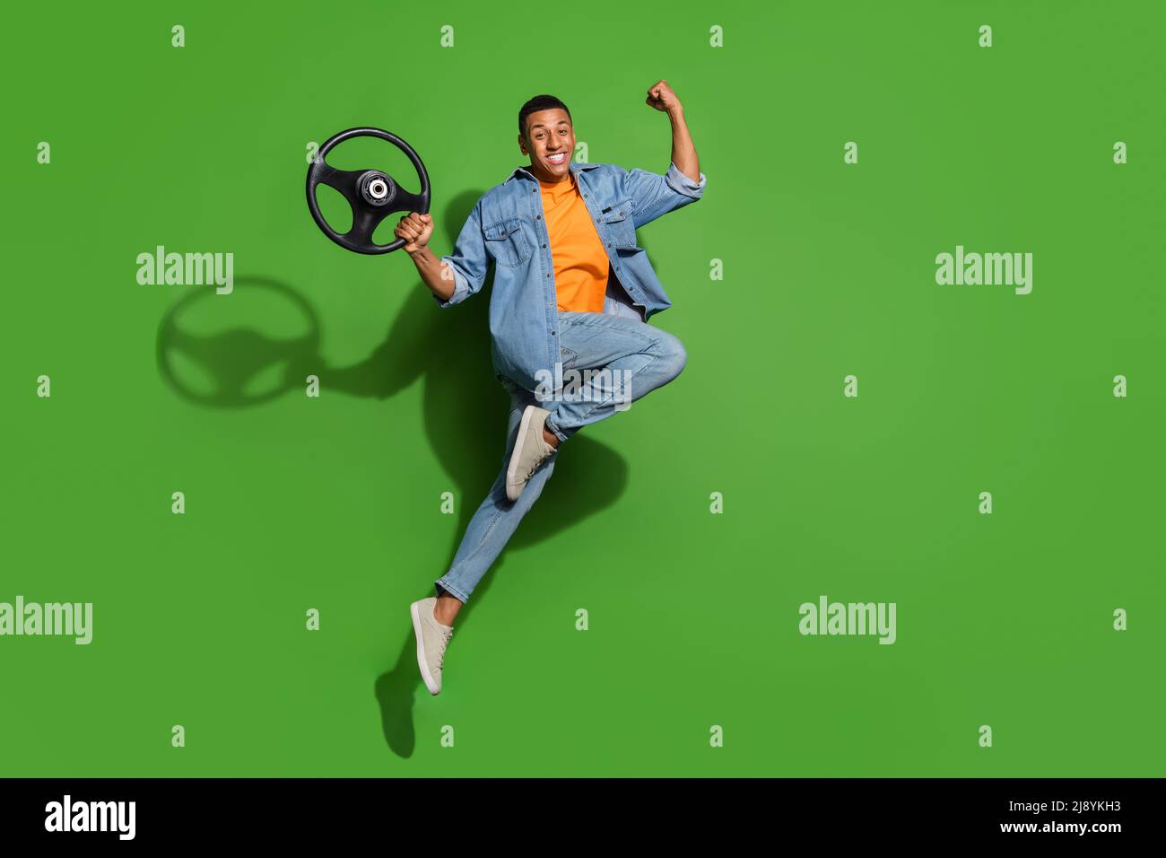 Full body image of positive young man jumping up in victory pass ...