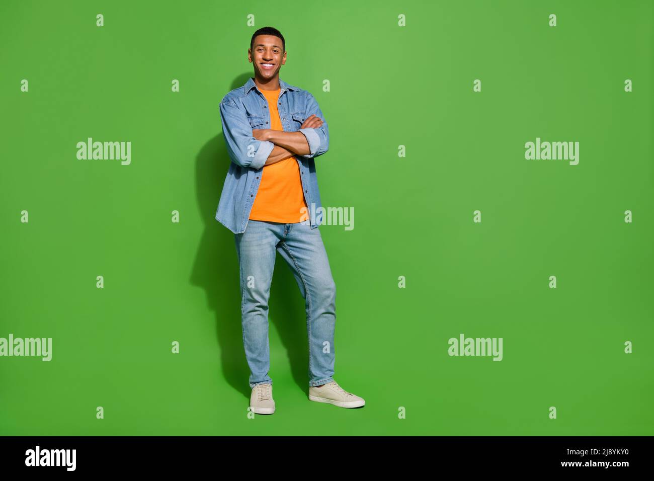 Full body photo of young intelligent entrepreneur man with folded hands ...