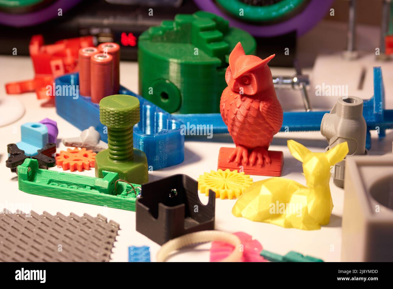 Collection of bright colorful objects printed on a 3d printer. Variety ...
