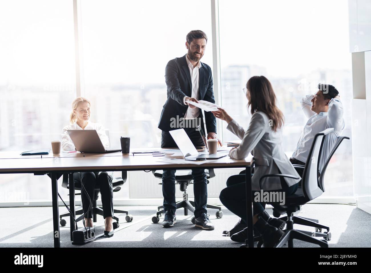 Corporate business team and manager in a meeting room at modern office ...