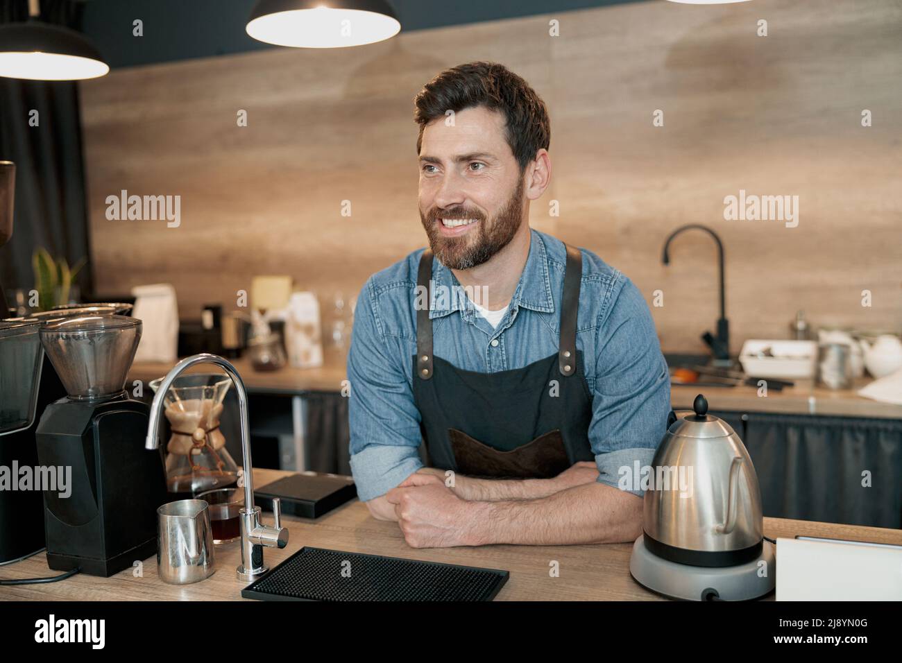 Barista behind cafe counter hi-res stock photography and images - Alamy
