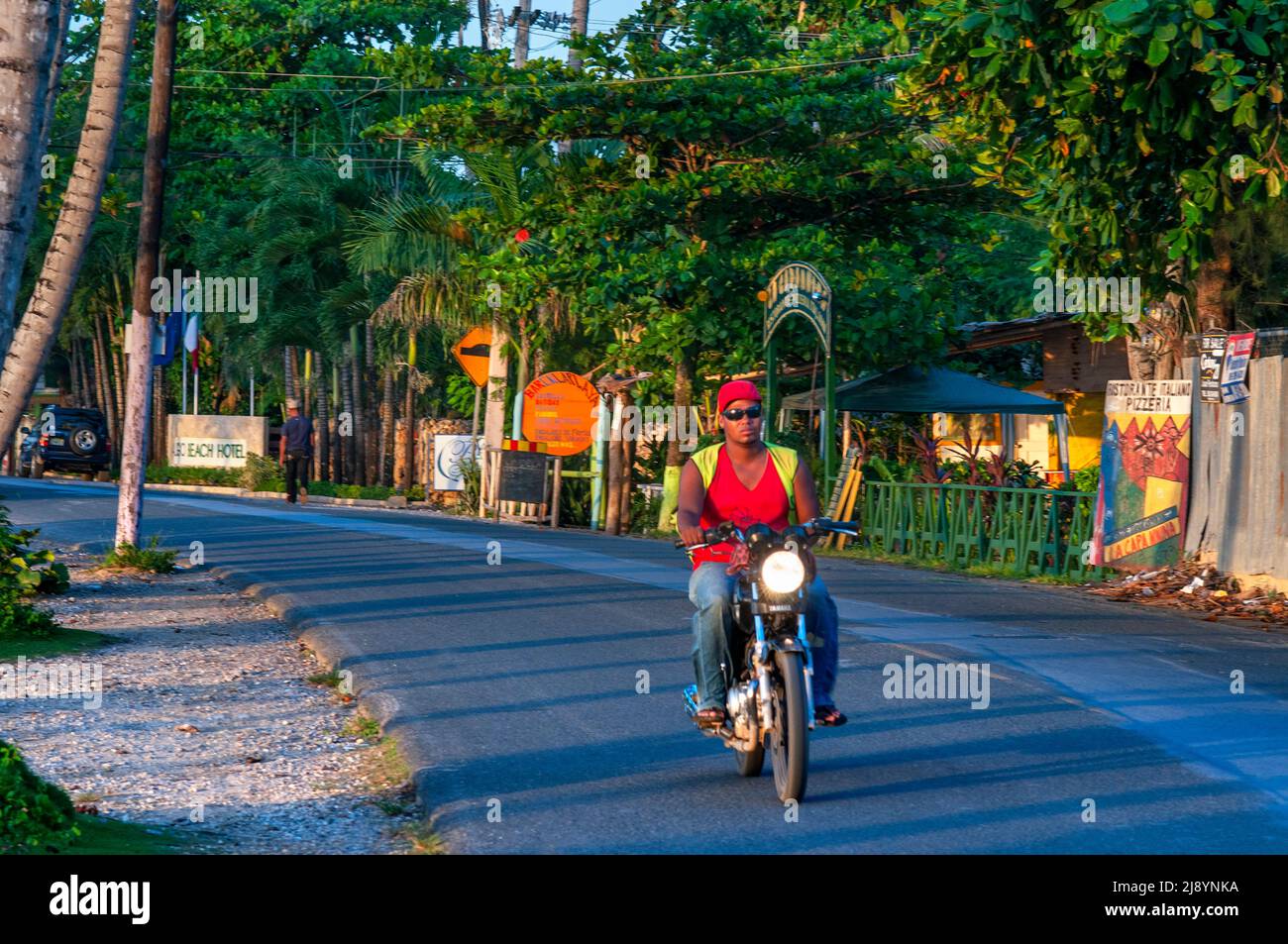 Local people in a motorbike in front Las Terrenas beach, Samana ...