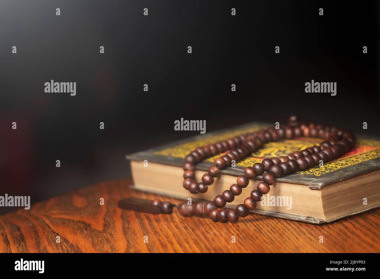 Background wallpaper of rosary beads (tasbih) and The holy coran Quran ...