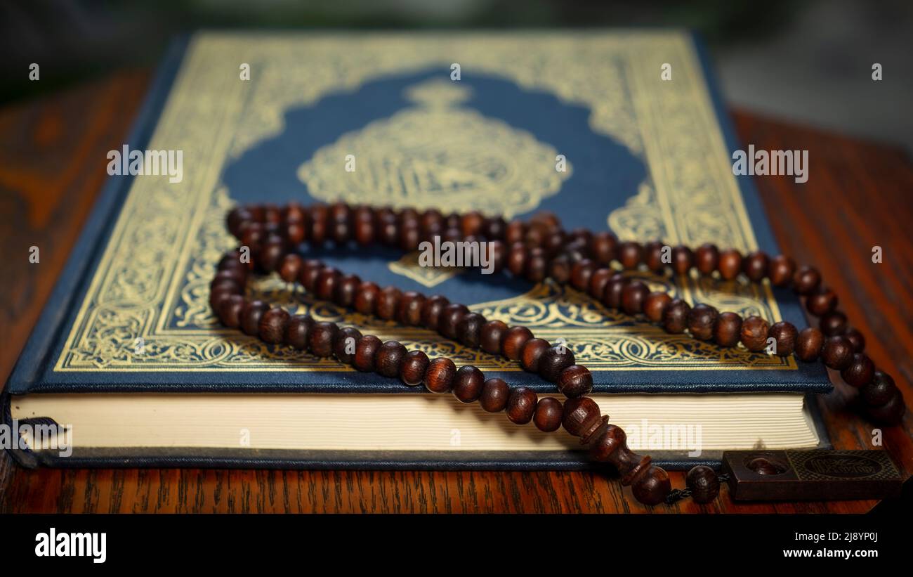 Background wallpaper of rosary beads (tasbih) and The holy coran Quran ...