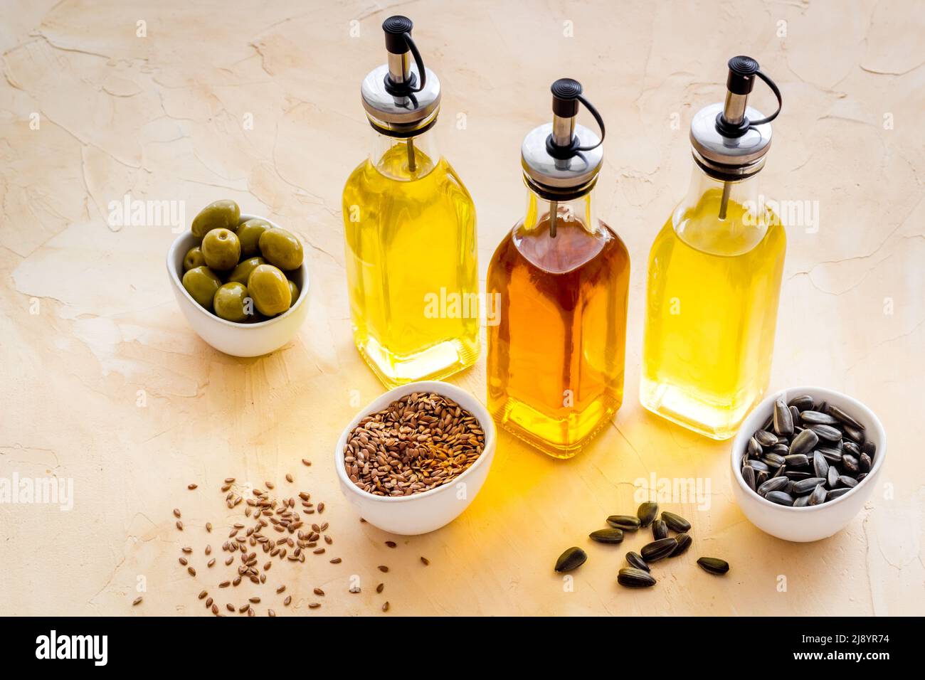 Bottles of different types cooking oil. Sunflower olive and sesame oil ...