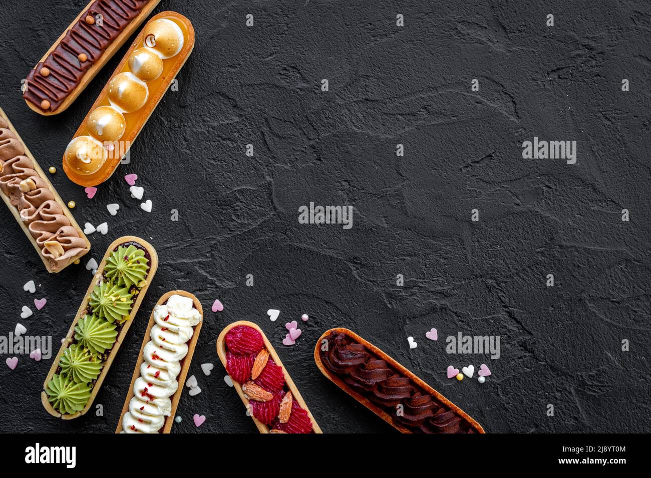 Set of delicious dessert eclairs with colorful topping Stock Photo - Alamy