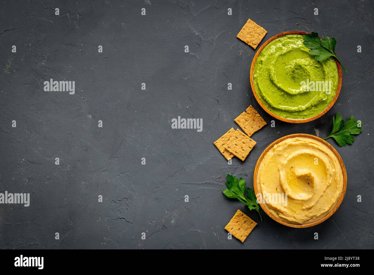Hummus with snacks set - various types of hummus in bowls Stock Photo ...
