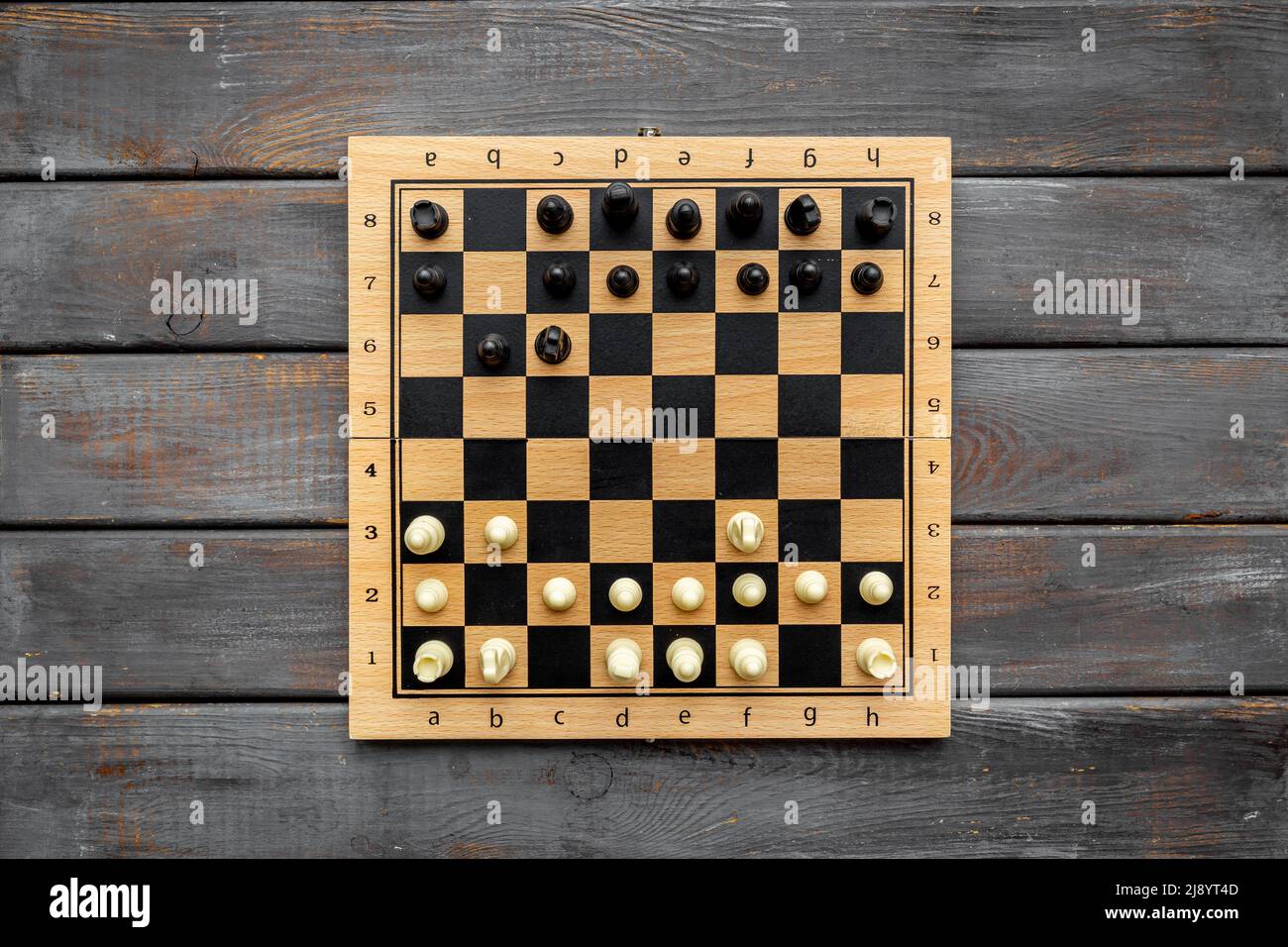 Chess pieces battle on chessboard. Teamwork concept Stock Photo - Alamy