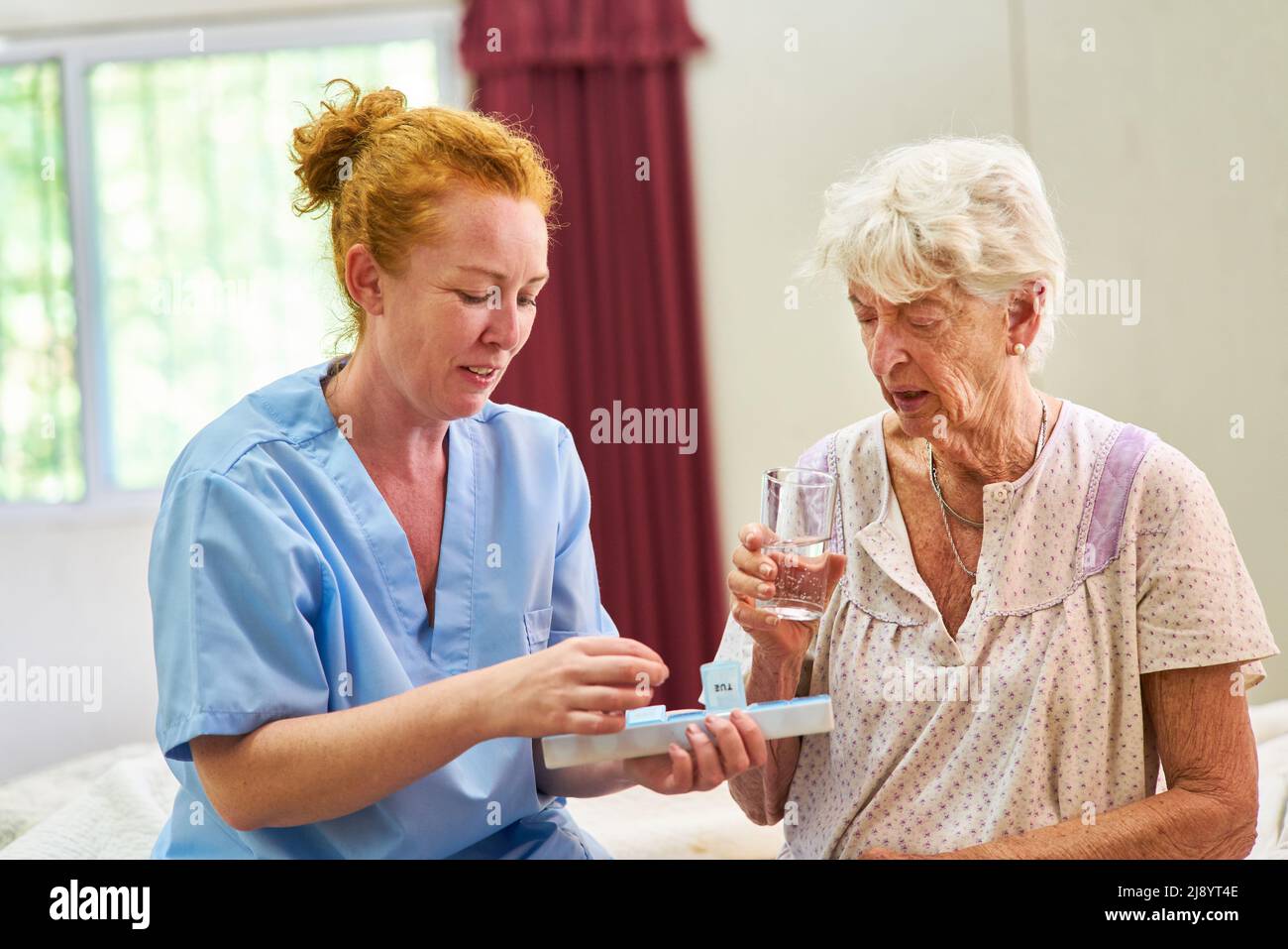 Nurse giving medication patient hospital hi-res stock photography and ...