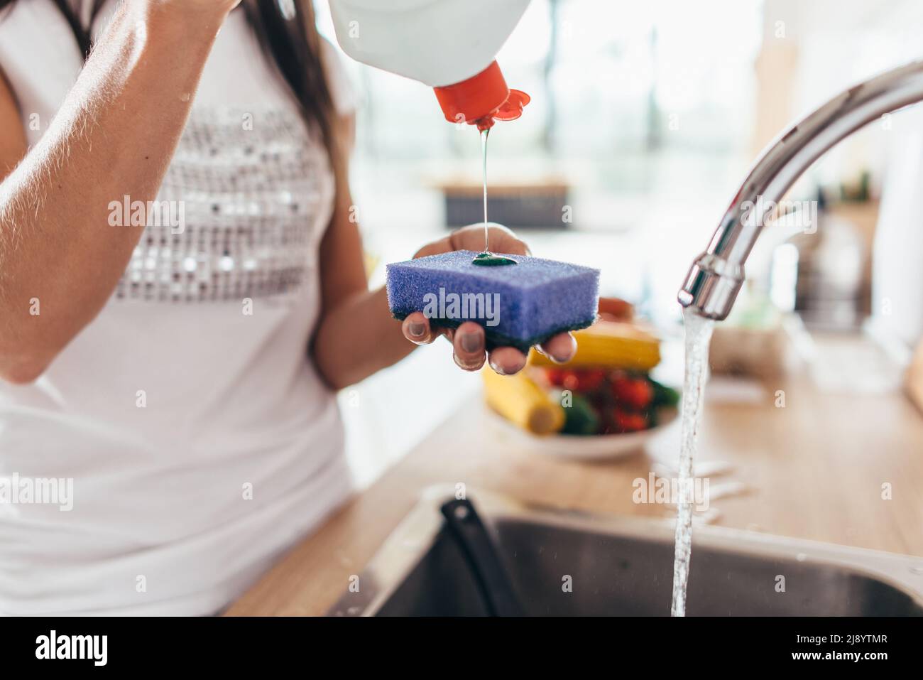 Hand washing dishes hi-res stock photography and images - Alamy