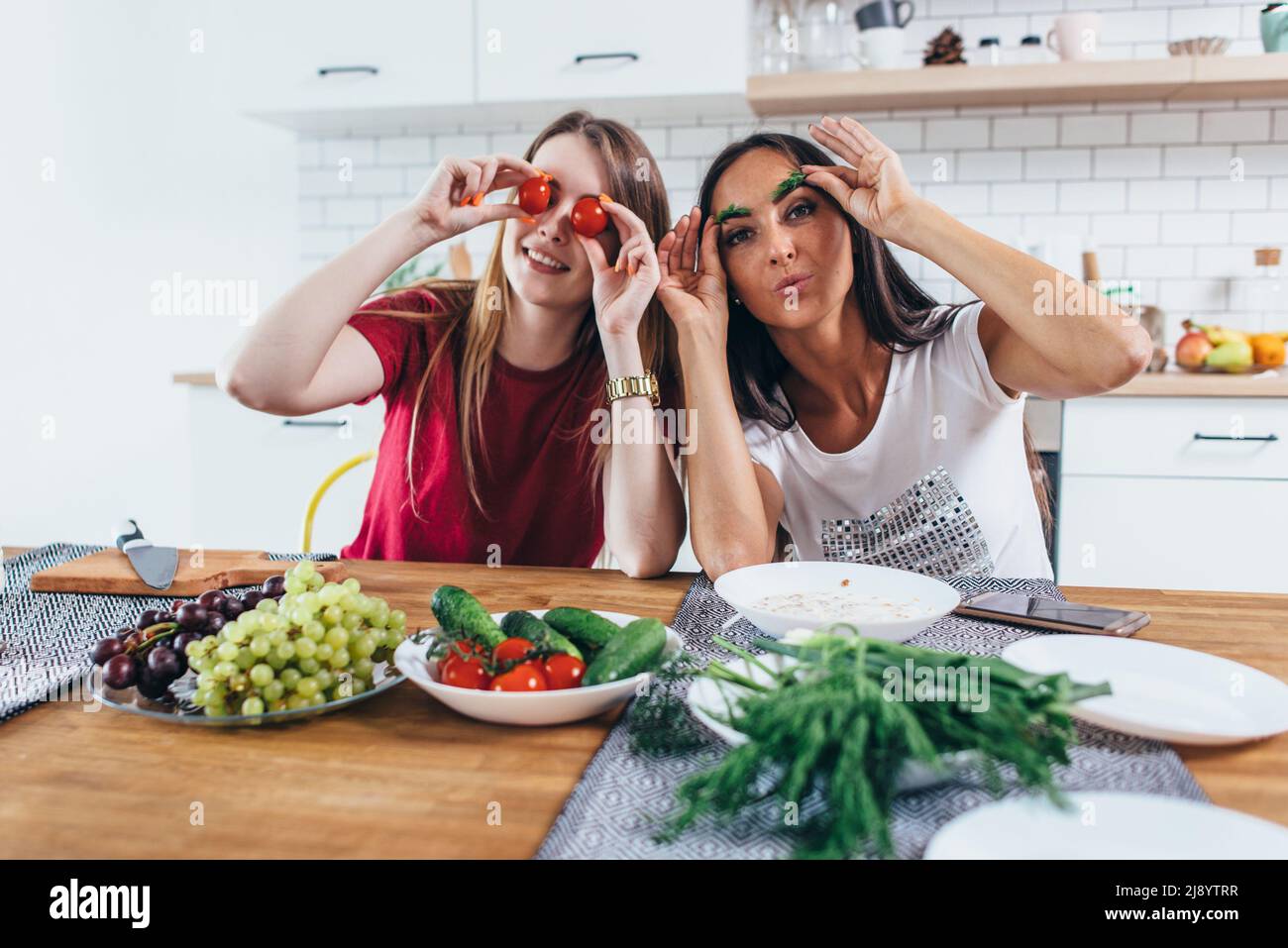 Girls playing with vegetables eyes hi-res stock photography and images ...