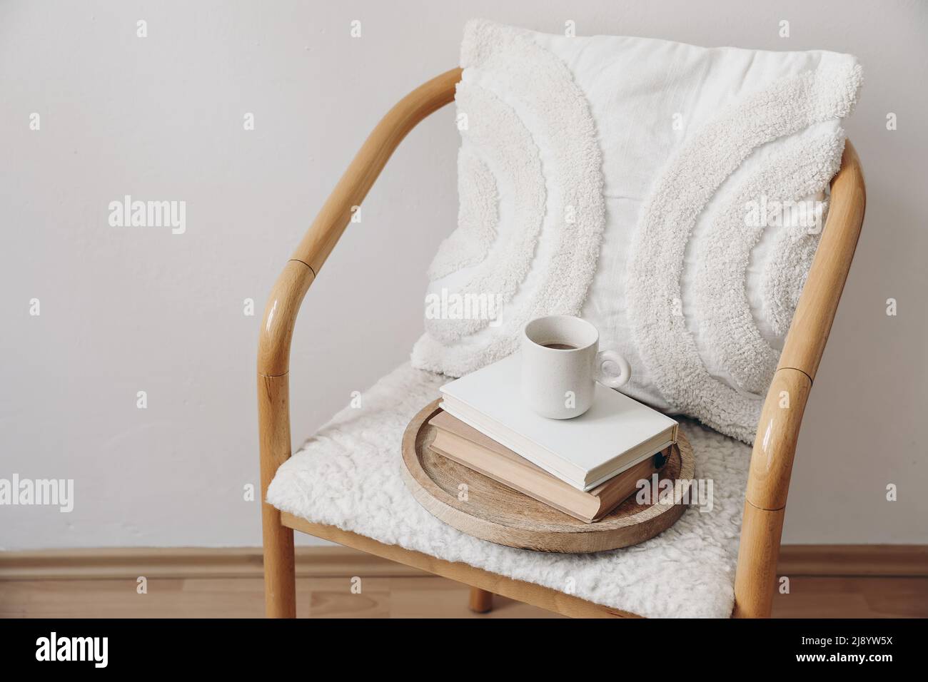 Wooden midcentury chair. Boho breakfast still life scene. Cup of coffee ...