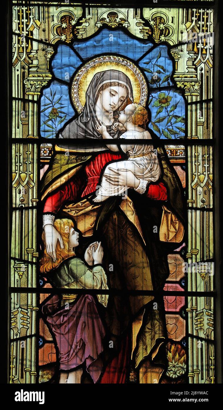 A stained glass window depicting Charity, St Bartholomew's Church ...