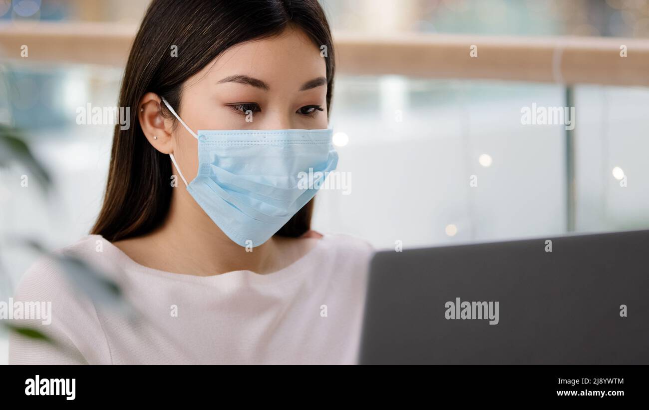 Asian student Korean business woman in medical face mask freelancer ...
