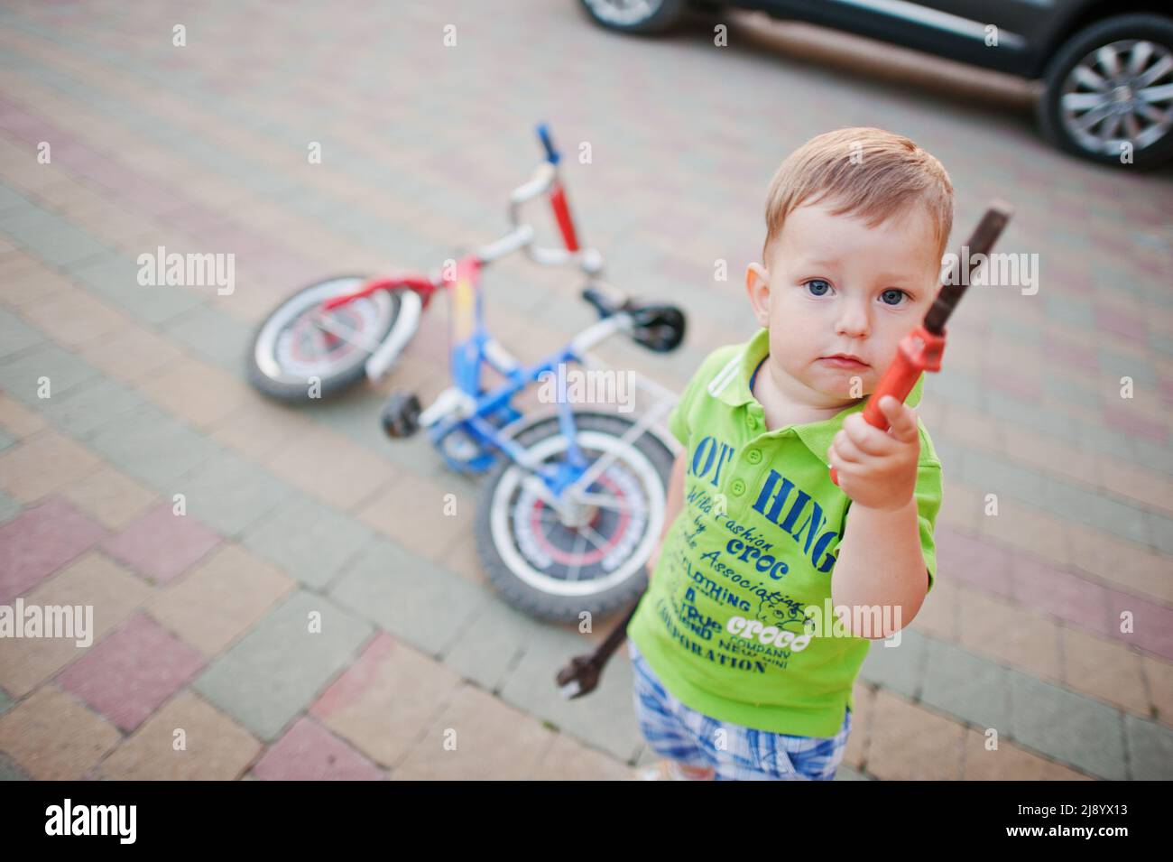 Boys repairing bicycle hi-res stock photography and images - Alamy