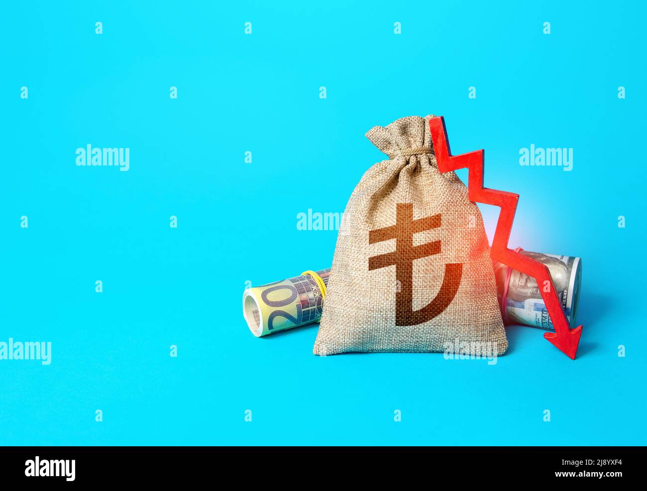 Turkish lira money bag and arrow down. Falling economy. Decrease in ...