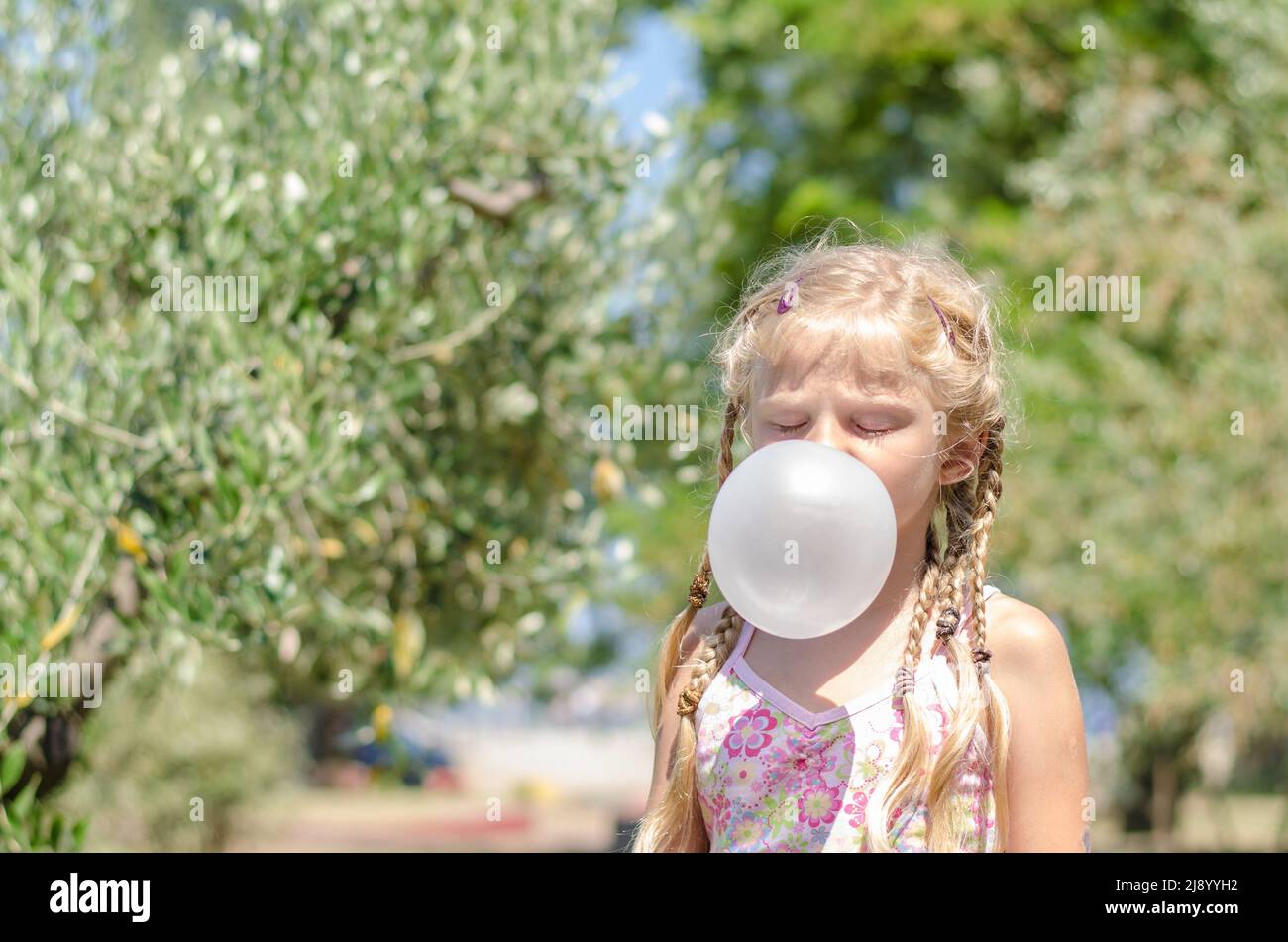 Pretty girl chewing bubble gum hi-res stock photography and images - Alamy