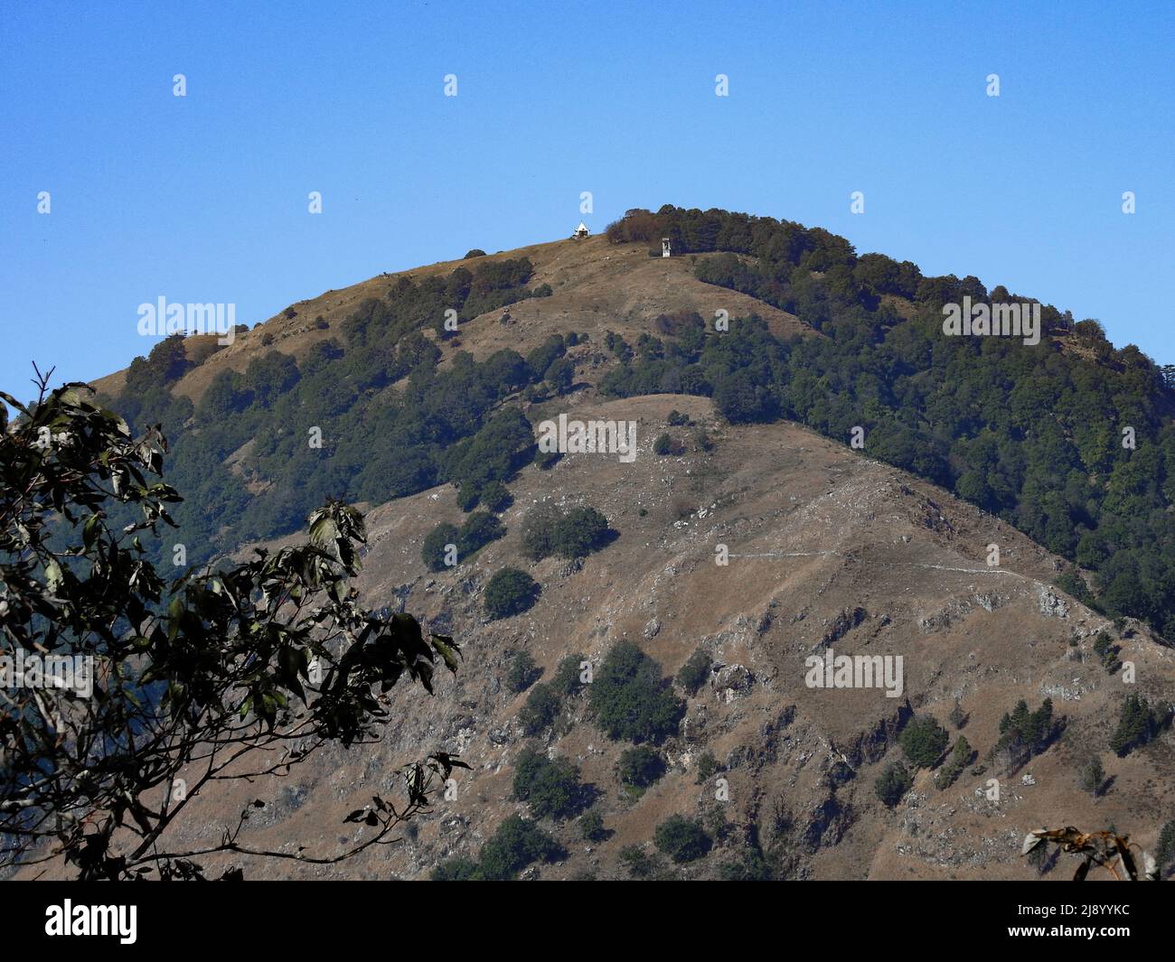A small temple on the hill top with blue sky. Mussoorie, uttarakhand ...