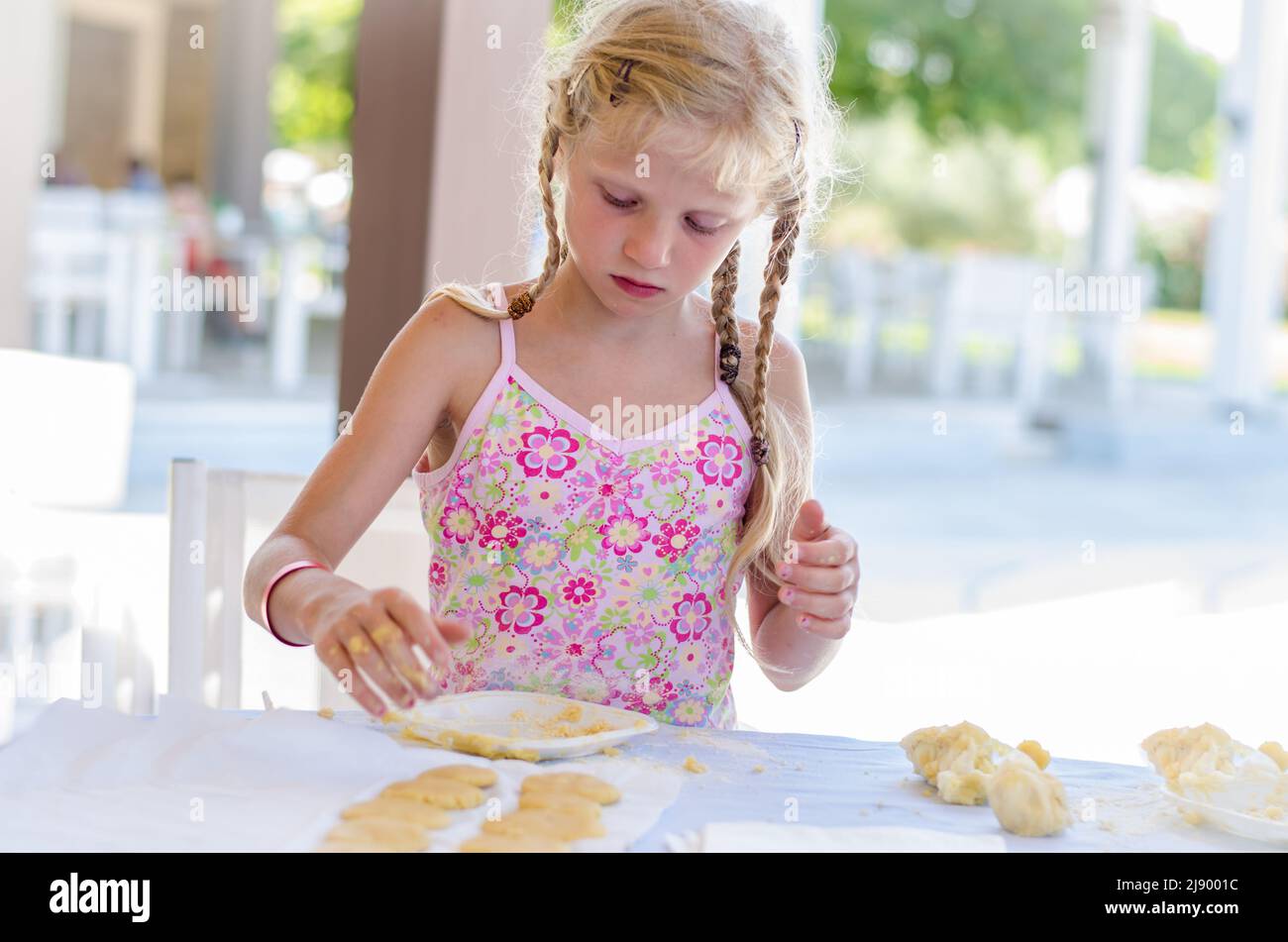 cute little child preparing sweet cakes Stock Photo - Alamy