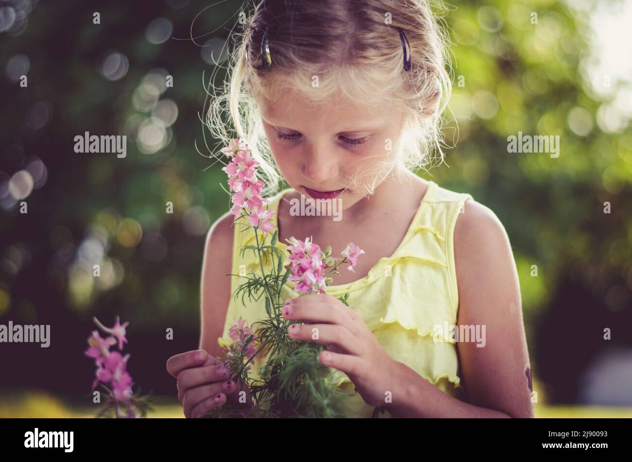 romantic child with pink flowers portrait Stock Photo - Alamy